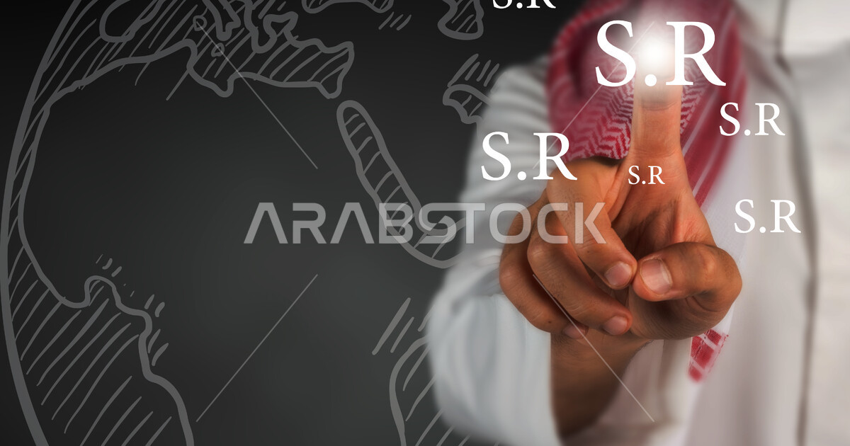 A close-up of the hand of a Saudi Arabian Gulf man in traditional dress ...