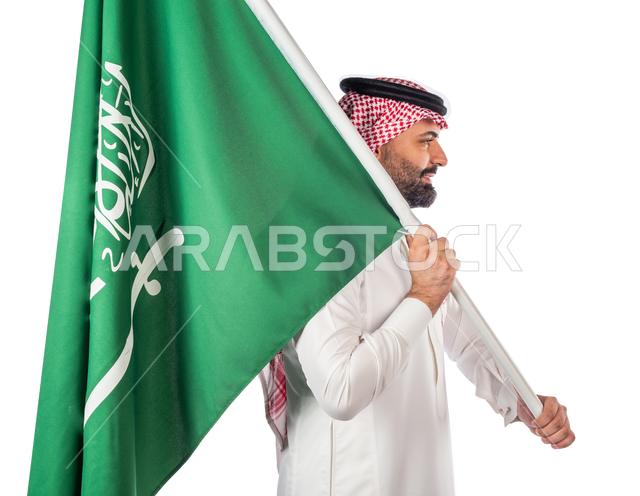 Portrait of a Saudi Arabian Gulf man holding the flag of Saudi Arabia ...