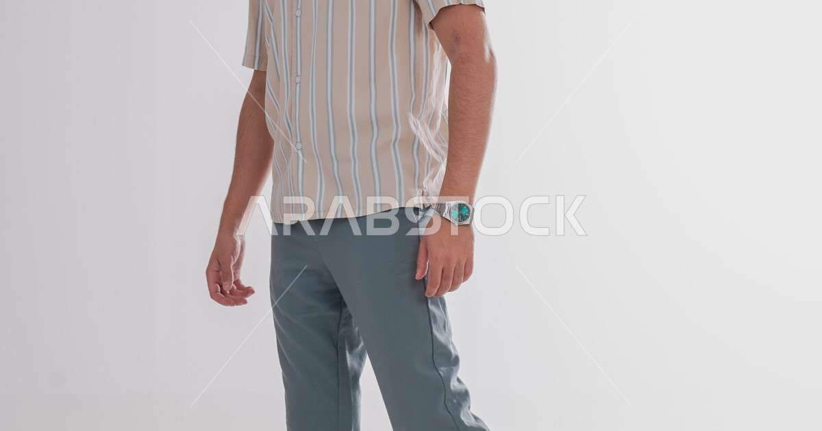 Listening to songs using a headphone, portrait of a Saudi Gulf Arab man ...