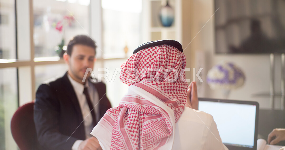 A Saudi Arabian Gulf work team, a meeting of businessmen to discuss ...