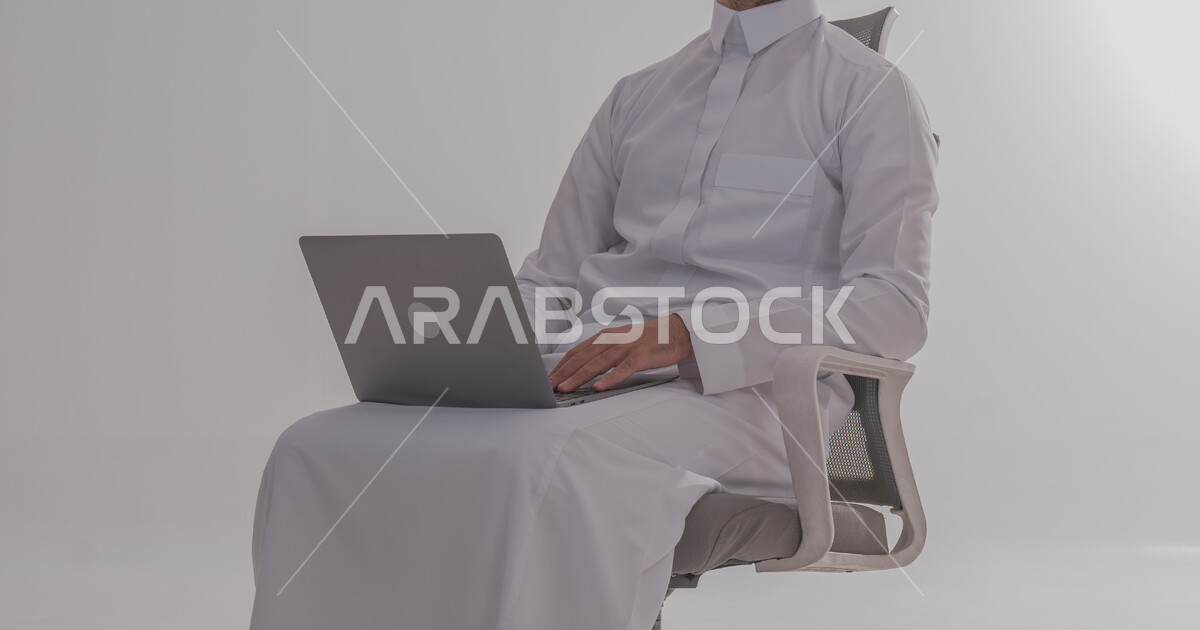Using modern technical devices, a portrait of a Saudi Gulf Arab man ...