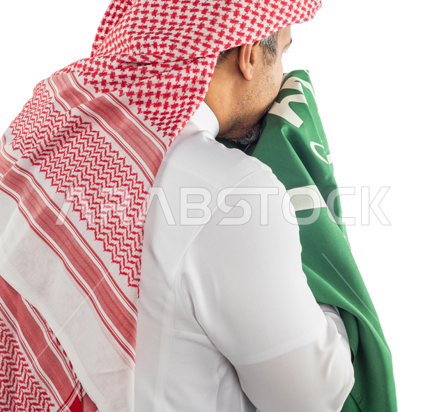 A Saudi Arabian Gulf man wearing traditional Gulf costume kisses the ...