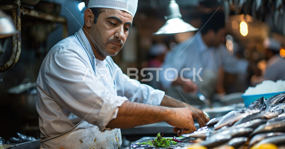 Delicious seafood, fast food, close-up of a Saudi Arabian Gulf chef ...