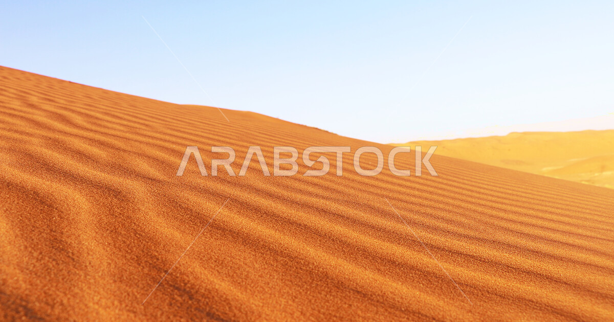 Soft golden sand plateaus, hills and dunes, desert areas and desert ...