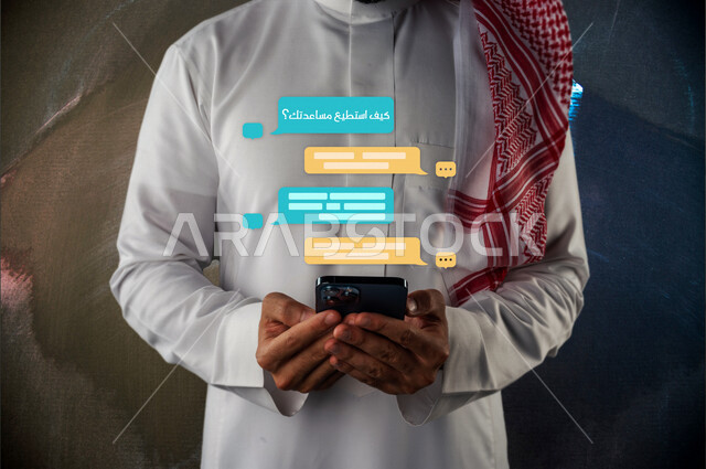 Close-up of a Saudi Arabian Gulf Arab man, using a mobile phone ...