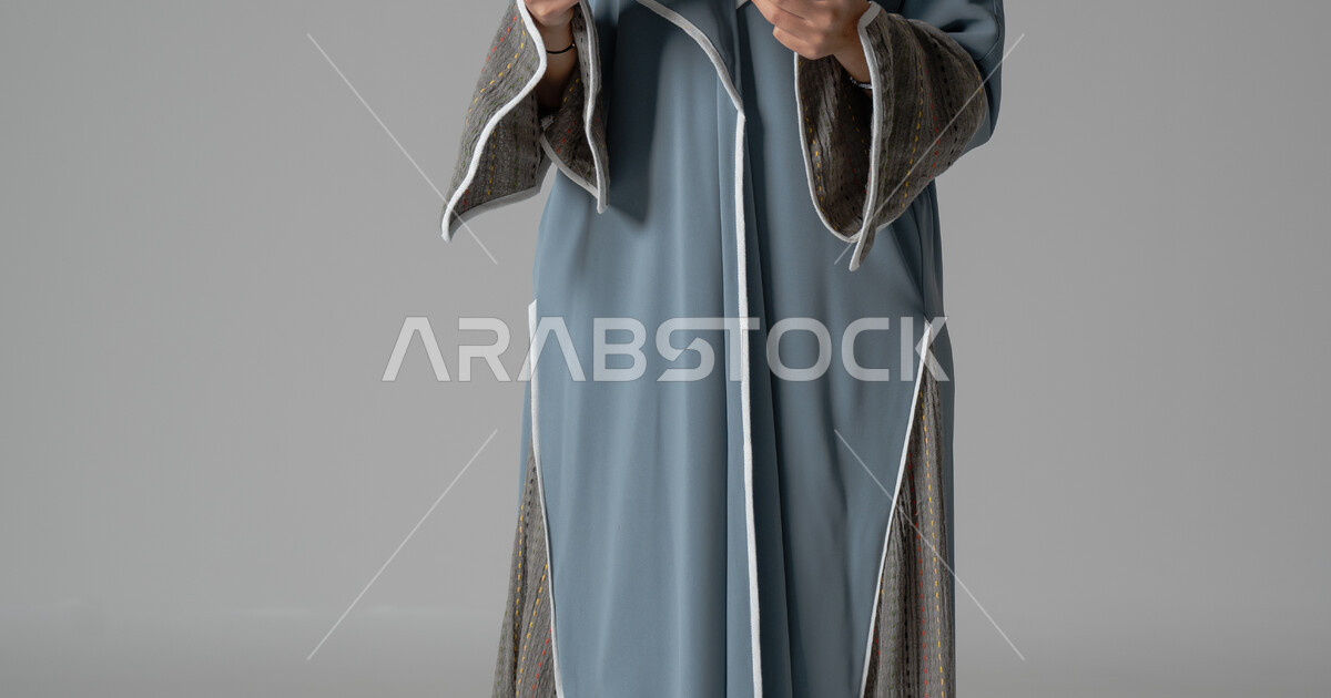 Concern about appearance, portrait of a veiled Saudi Arabian Gulf woman ...