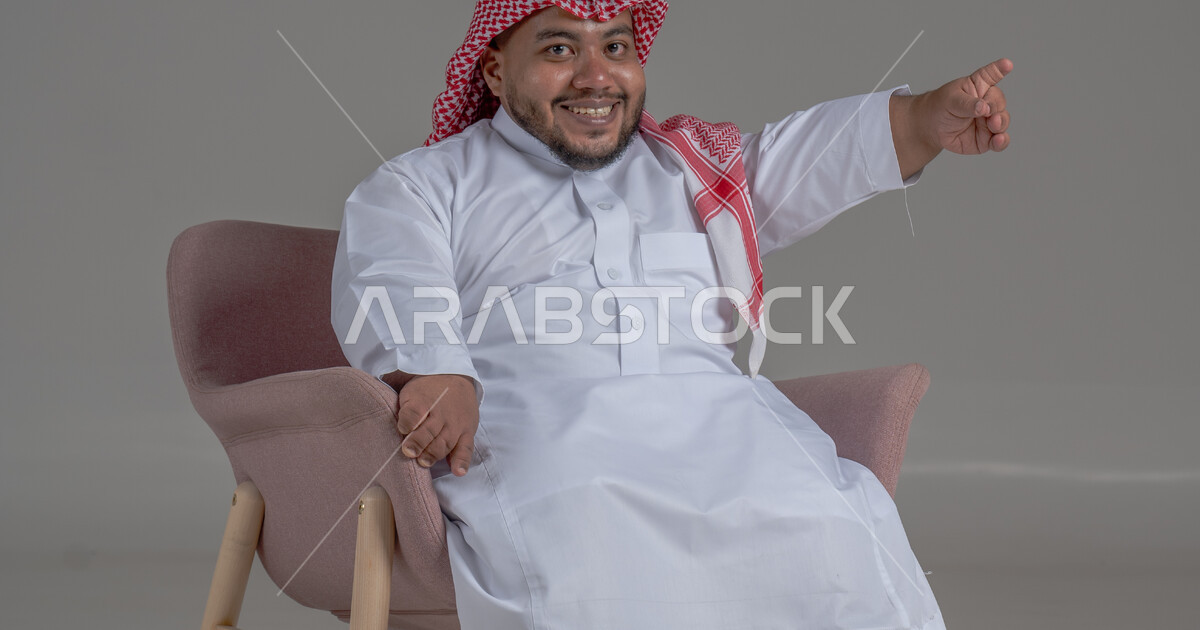Elegance and interest in appearance, portrait of a smiling short Saudi ...