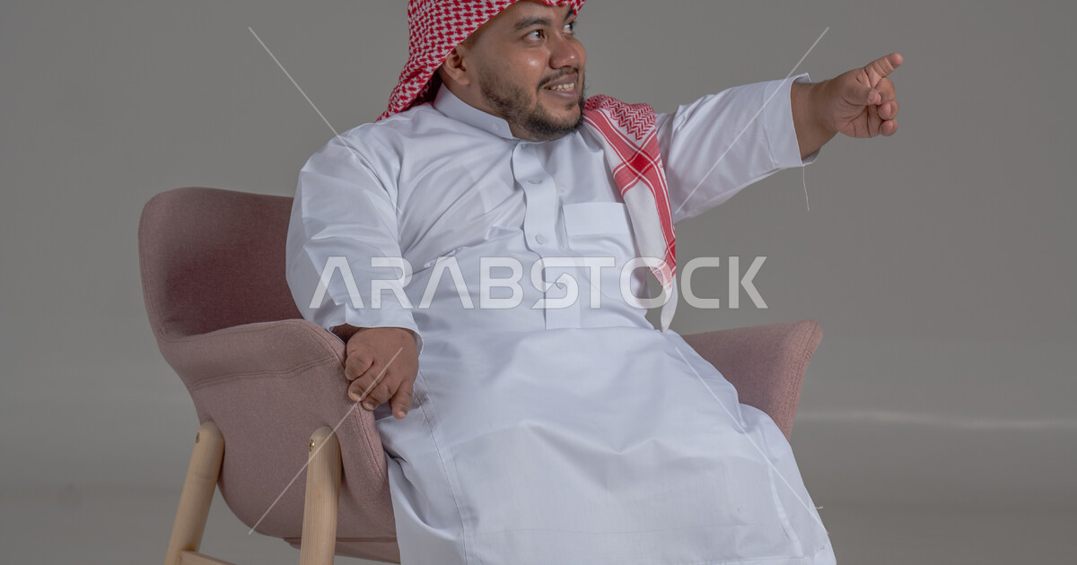 Elegance and interest in appearance, portrait of a smiling short Saudi ...