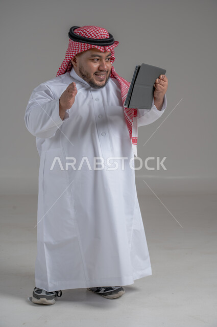 Using technology and modern techniques, portrait of a short Saudi ...