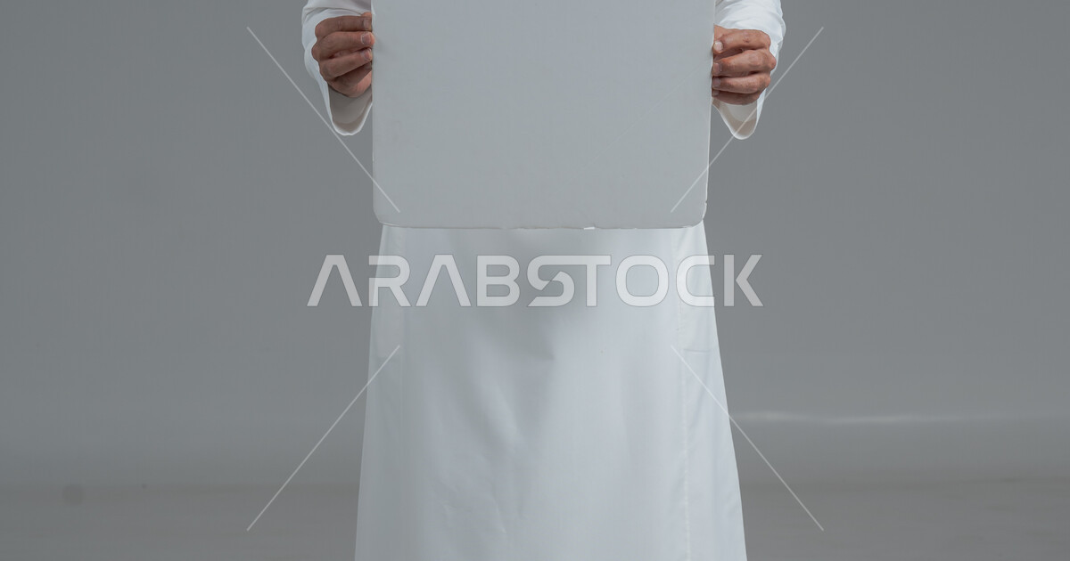 White mockup, blank billboard, portrait of a Saudi Arabian Gulf man ...