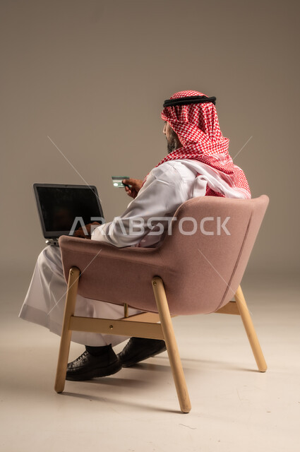 Holding a business meeting online, browsing social media, using laptop ...