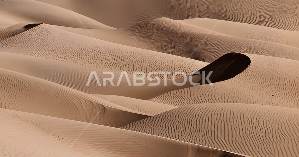 Plateaus, hills and soft golden sand dunes, the dry environment and ...