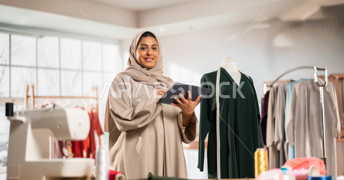 Using modern technical electronic devices, fashion design workshop ...