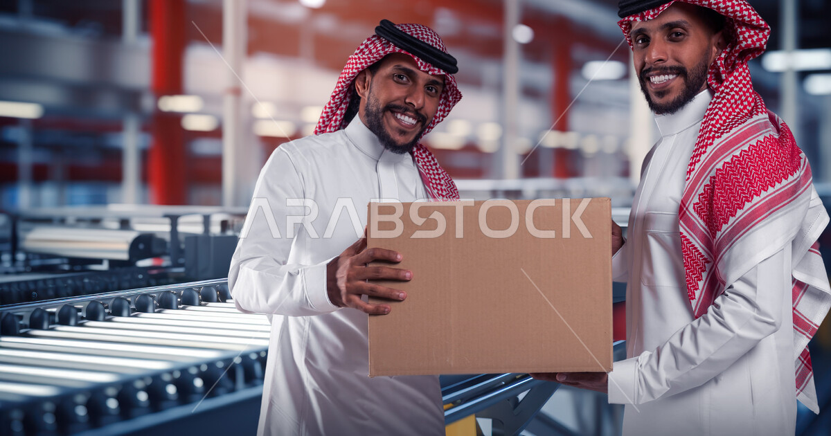 Home delivery services, close-up of two young Saudi Arabian Gulf twins ...