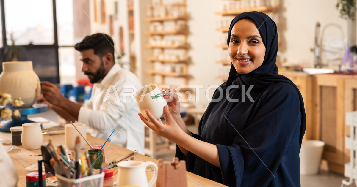 Professional Saudi Arabian Gulf workers working in the art workshop ...
