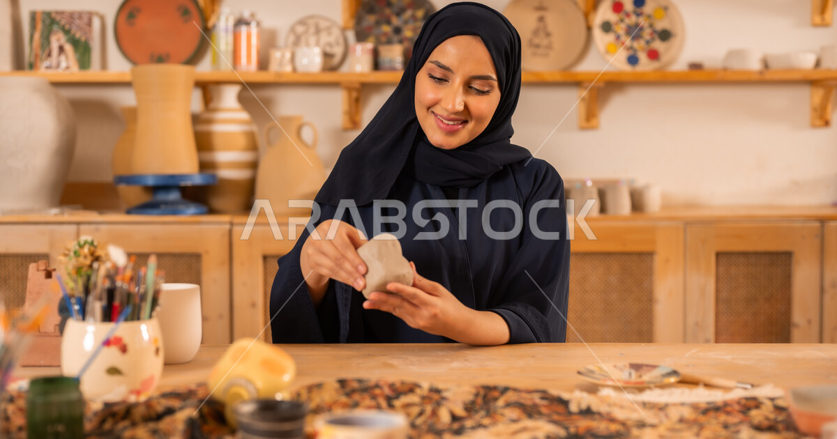 Handicrafts, traditional folk crafts and professions, a veiled Saudi ...