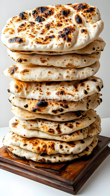 Fresh hot baked goods, traditional Arabic bread loaves (pita), bakeries ...