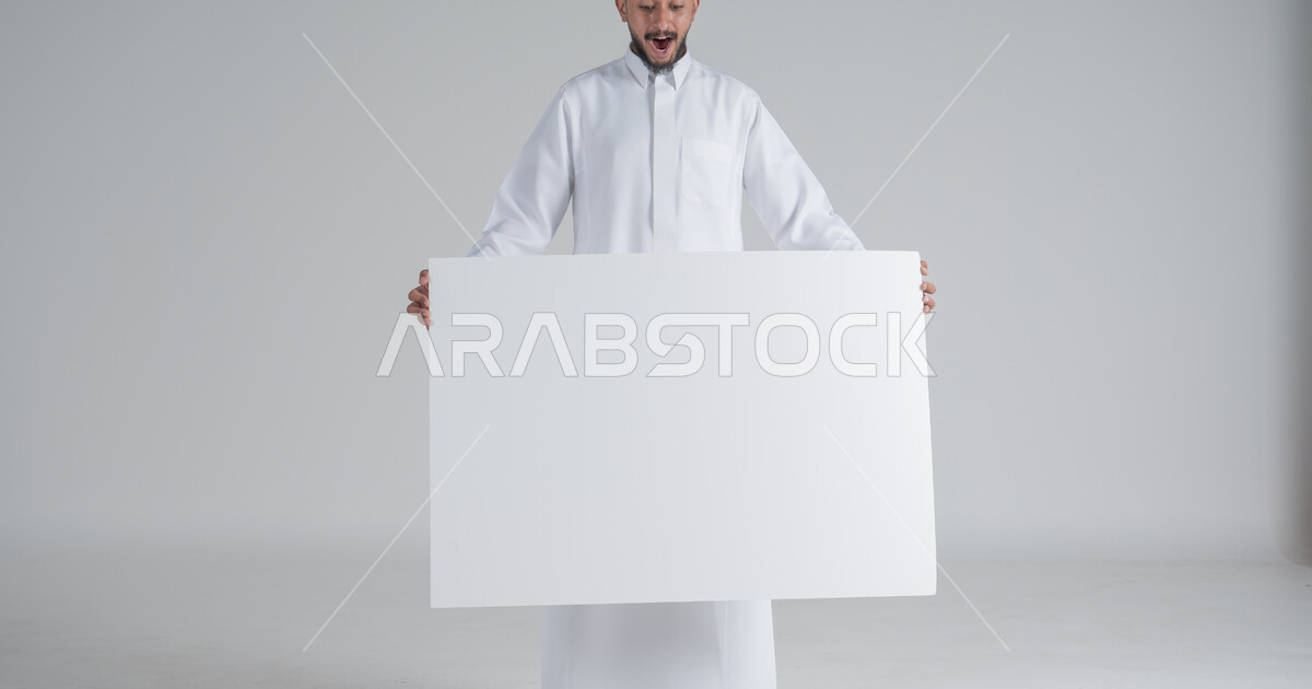 Advertisements and marketing offers, portrait of a young Saudi Arabian ...