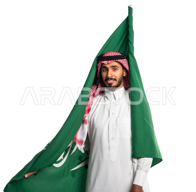 Portrait of a Saudi Arabian Gulf Arab man putting on his back the flag ...