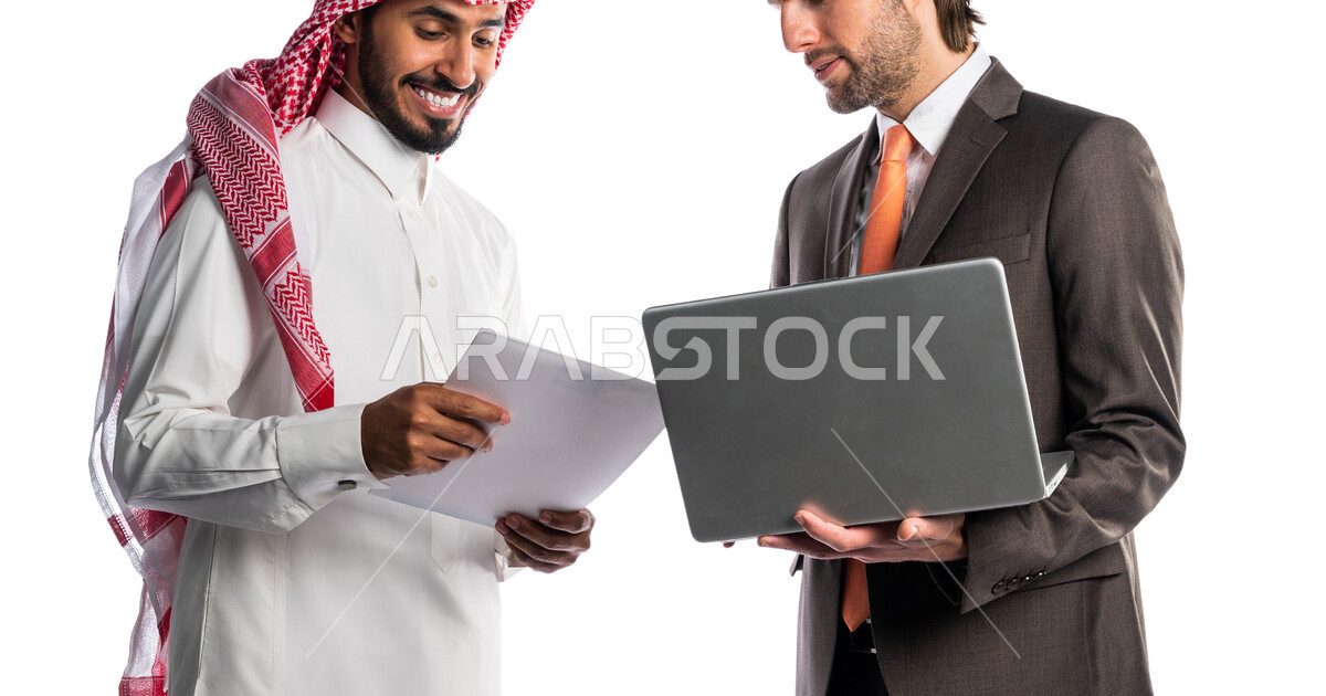 Portrait of a Gulf Saudi man in traditional Saudi dress, standing next ...