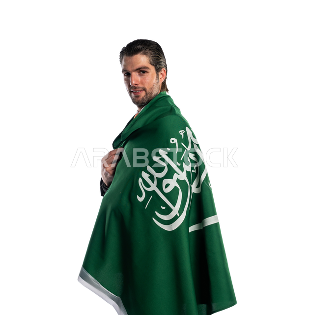 Portrait of a foreign man putting on his back the flag of Saudi Arabia ...