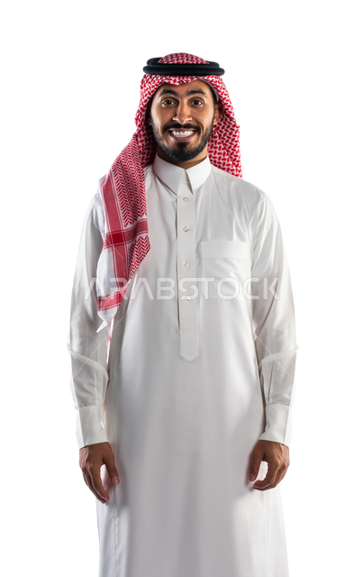 Portrait of a smiling Saudi Gulf man doing a photo session looking at ...