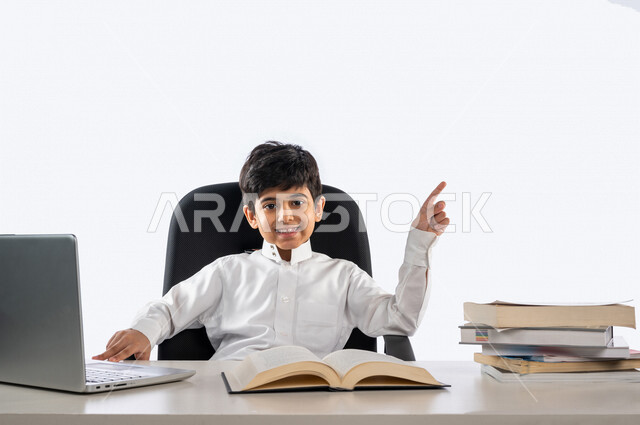 Portrait of a smiling Saudi Arabian Gulf student wearing the ...