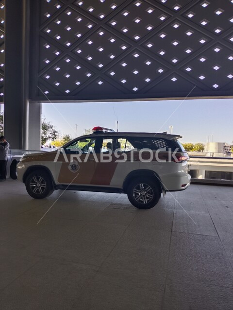 A four-wheel drive police car parked inside a modern building ...