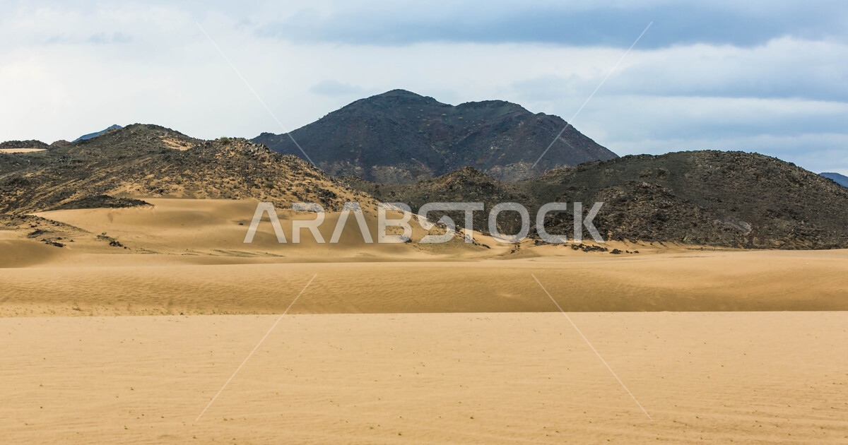 Close-up of the desert in Saudi Arabia, the rocky mountains and sand ...