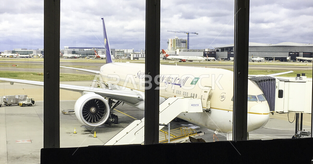 A picture of a Saudi plane at the airport from the waiting room window ...