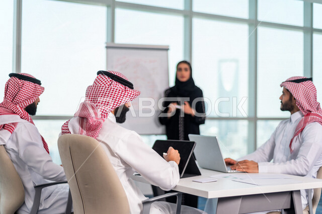 Meeting of a group of Saudi Gulf businessmen and businesswoman inside ...