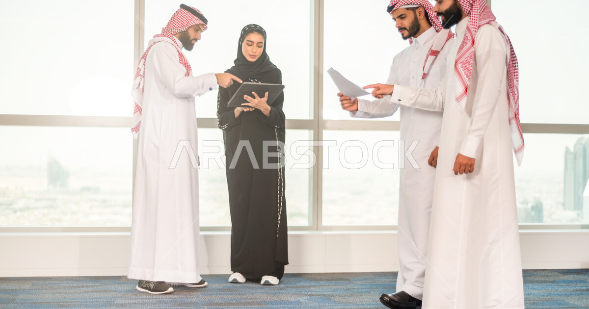 A group of Saudi businessmen inside the company's headquarters ...