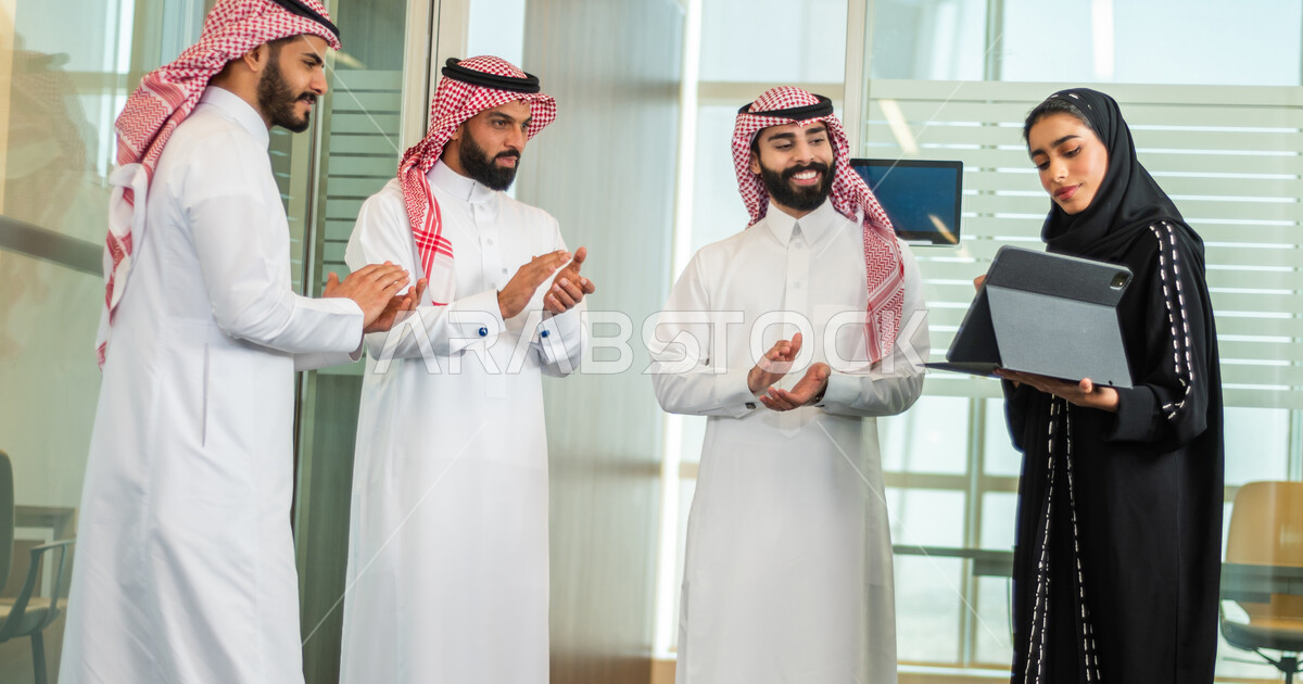 A group of Saudi businessmen inside the company's headquarters ...
