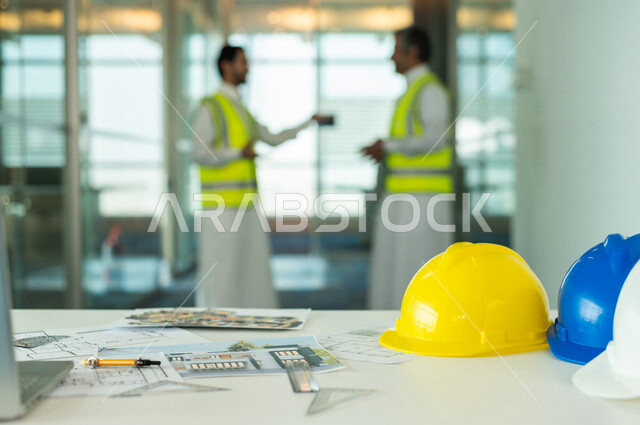 Close-up of an engineering office with the background of two Saudi Gulf ...