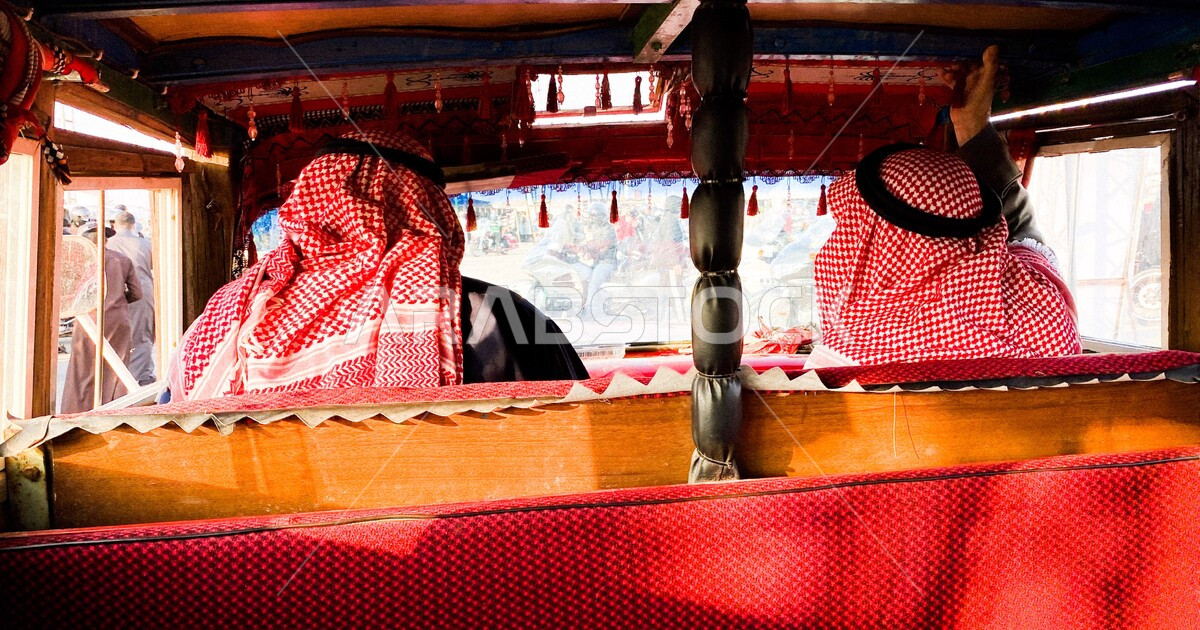 Close-up of a back corner of two young Saudi Arabian Gulf men inside an ...
