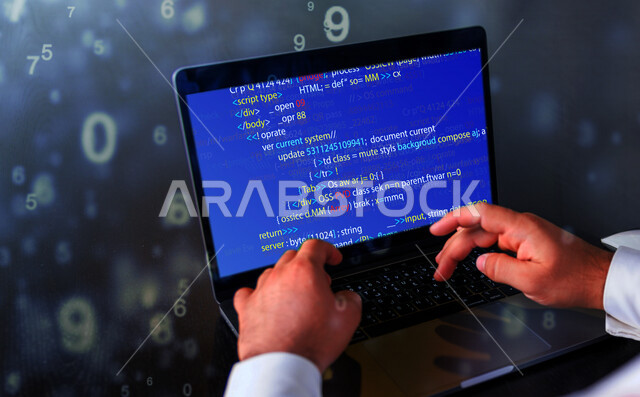 A young Saudi Gulf working as a web developer, using programming ...