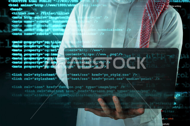A young Saudi Gulf working as a web developer, using programming ...