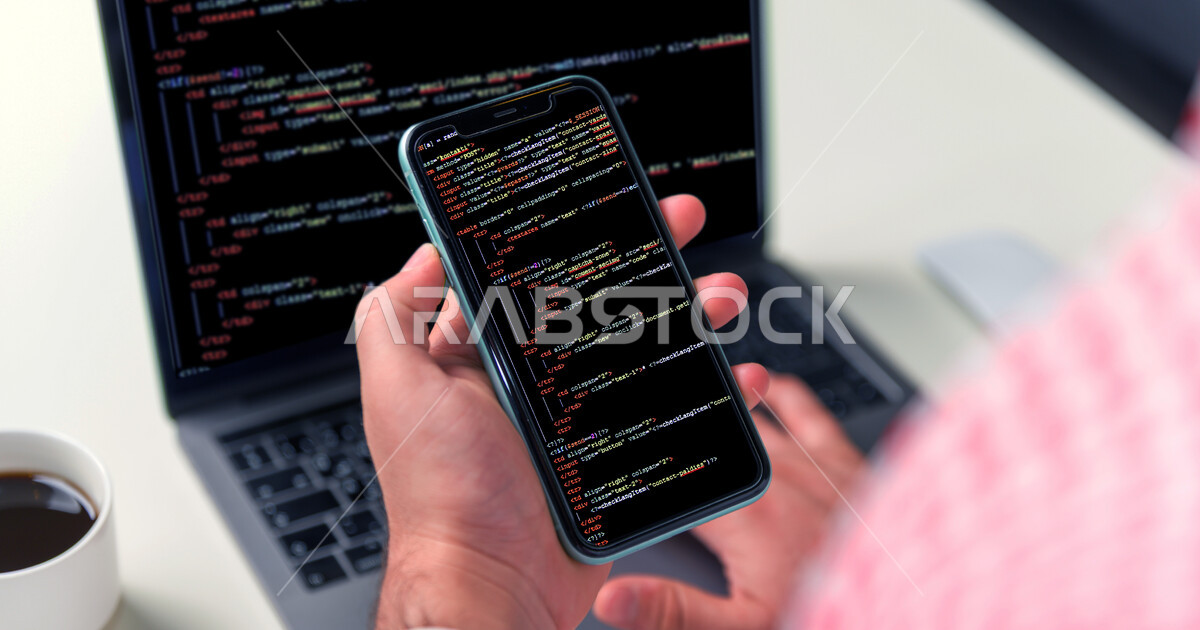 Hand image of a young Saudi Gulf working as a web developer, using ...