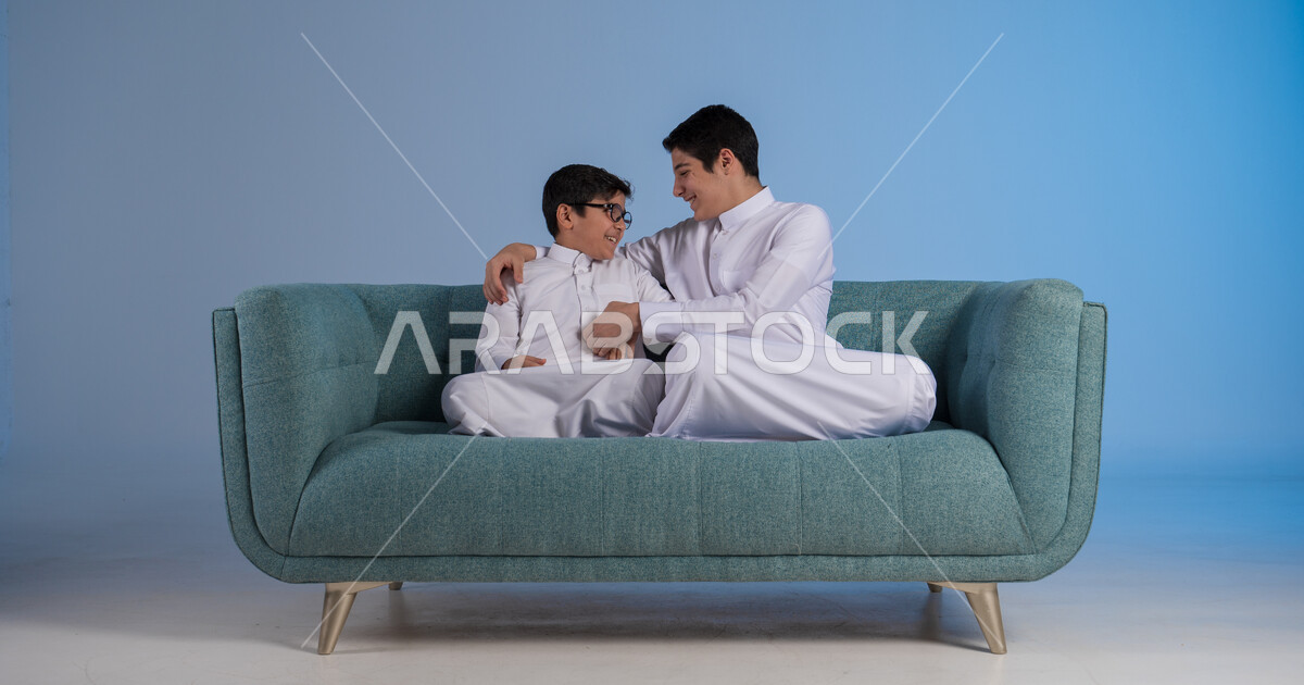 Happy family concept, portrait of two Saudi Arabian Gulf brothers ...