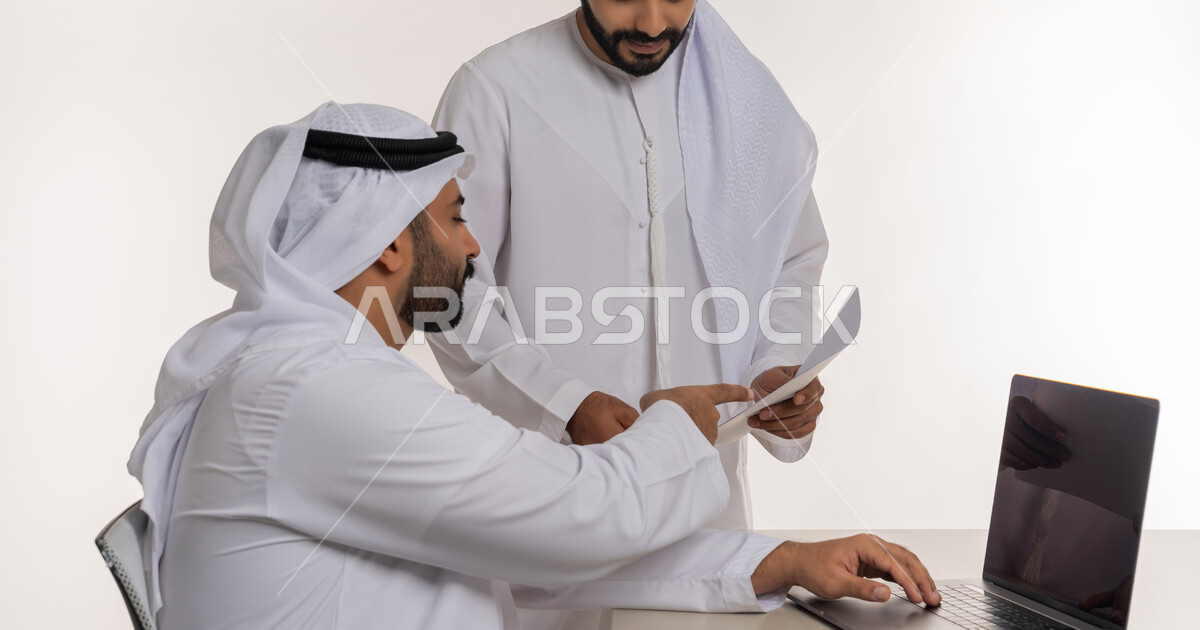 Collaborative management concept, close up side portrait of two Emirati ...