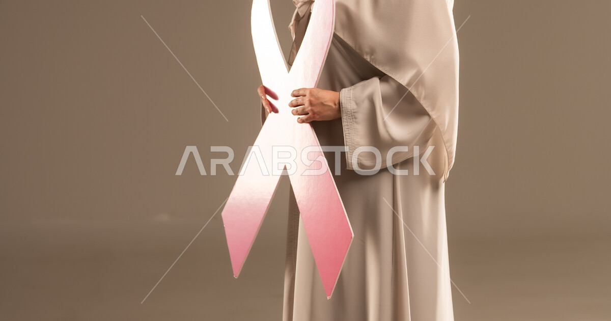 Cancer awareness campaign, portrait of a smiling Saudi Arabian Gulf ...