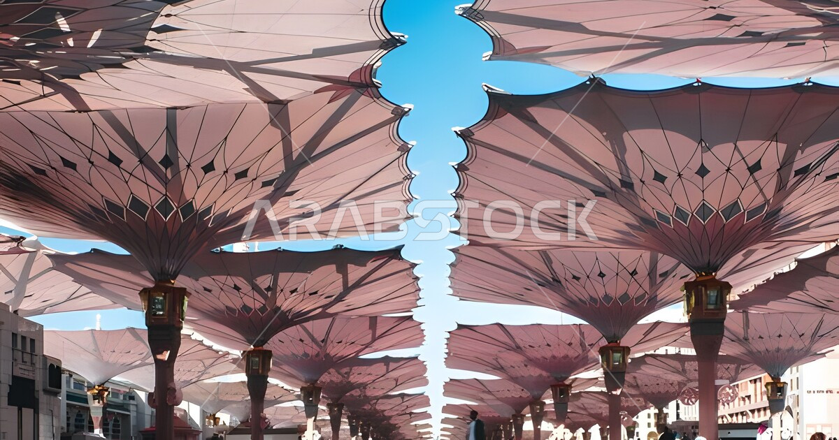 Electronic umbrellas in the courtyard of the mosque in Medina, worship ...