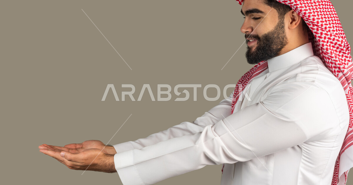 Portrait of a Saudi Gulf man making different hand gestures, opening ...