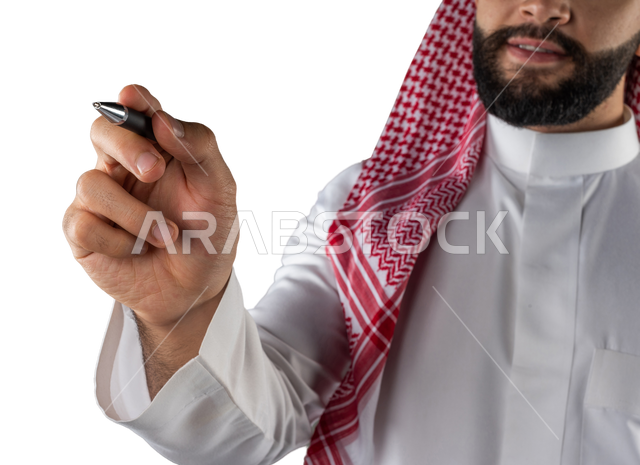 Portrait of a Saudi Arabian Gulf man wearing traditional dress holding ...