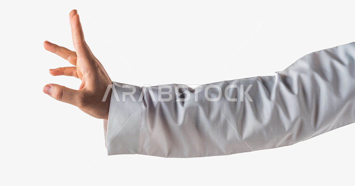 Portrait of a Saudi Gulf man wearing traditional Gulf clothing, making ...