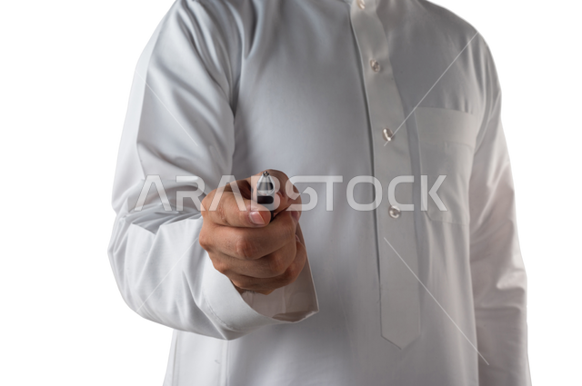 Portrait of a Saudi Gulf man wearing traditional Gulf dress holding a ...