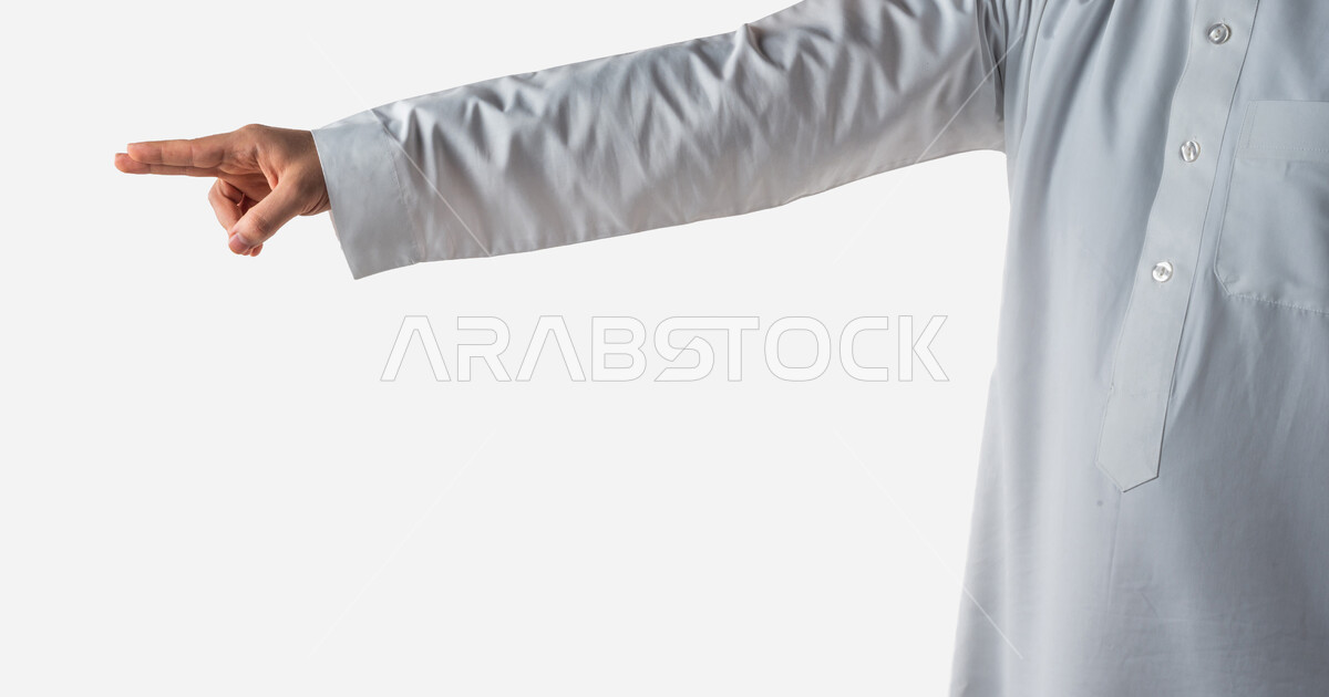 Portrait of a Saudi Gulf man wearing traditional Gulf clothing, making ...