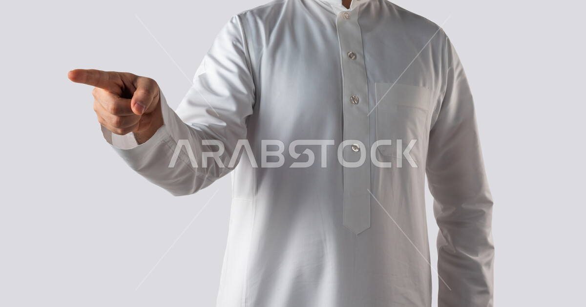 Portrait of a Saudi Gulf man making different hand gestures, pointing ...