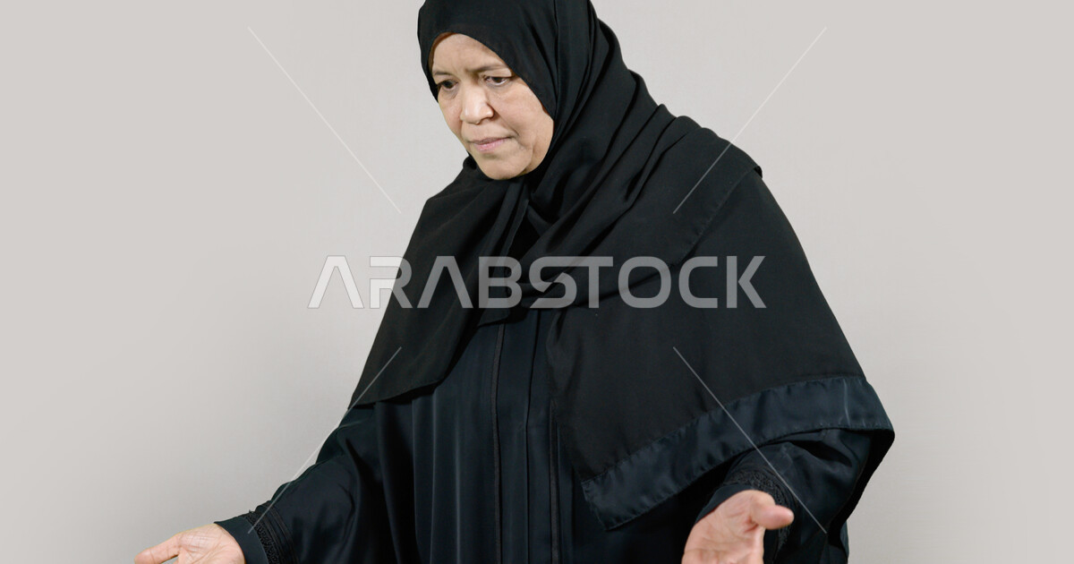 Portrait of an old Saudi woman with a lost and bewildered look, an Arab ...