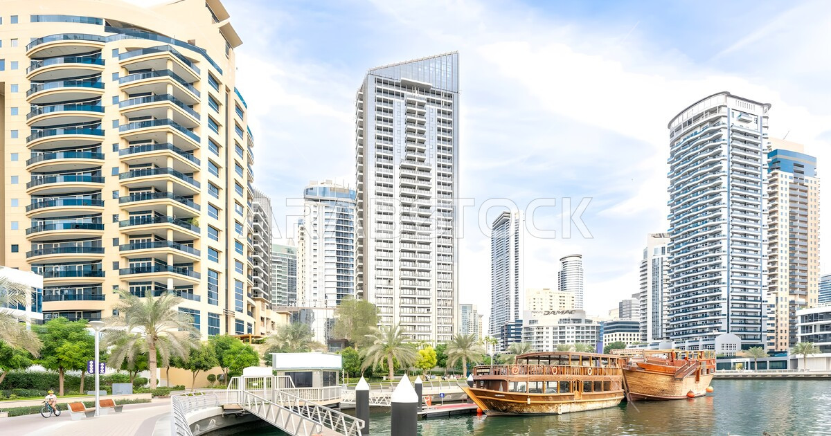 Waterfront on the Arabian Gulf coast, movement of yachts and ships at ...